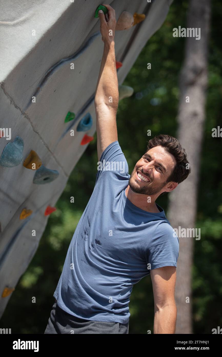 Man hanging from cliff hi-res stock photography and images - Alamy