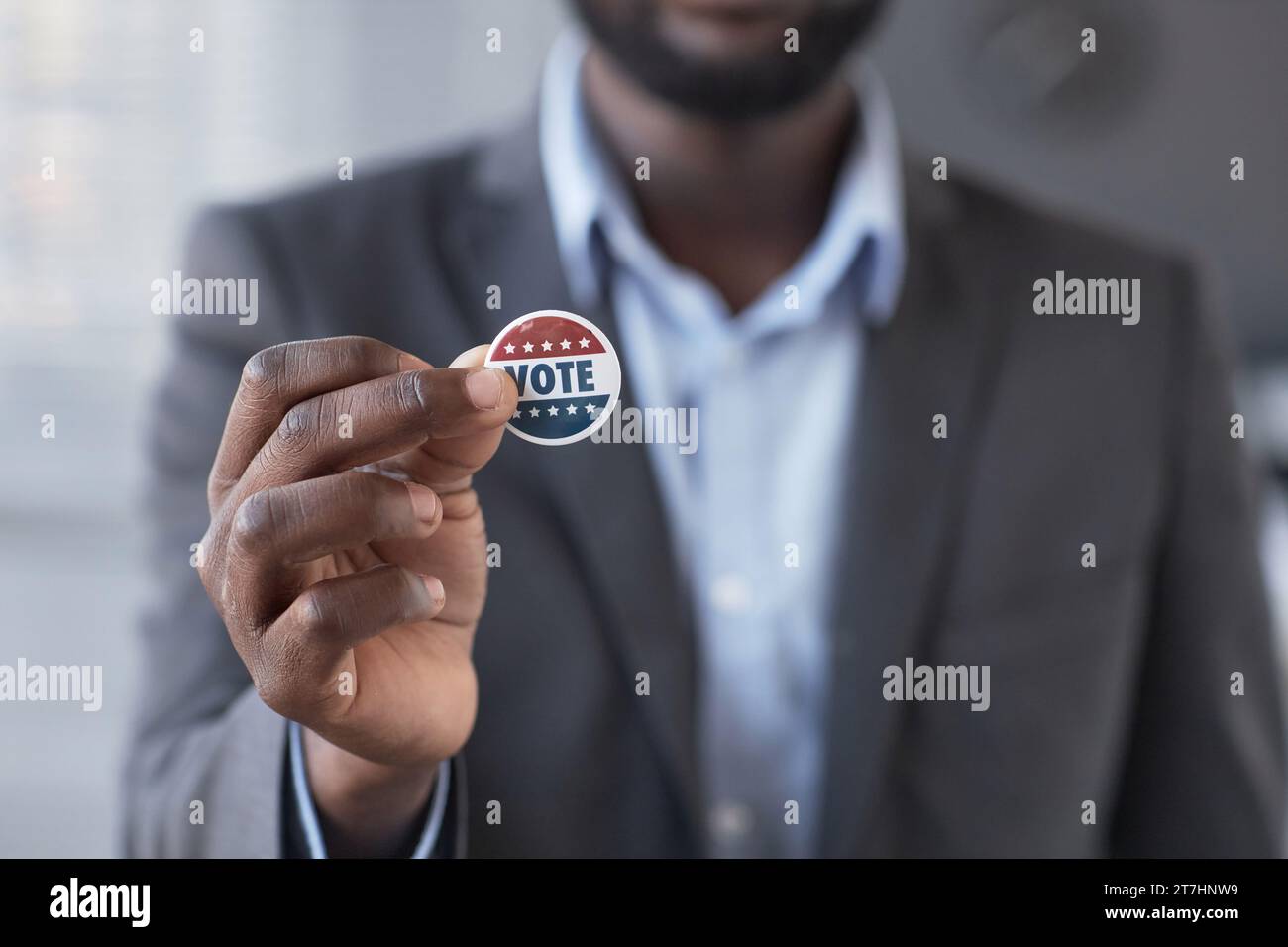 Hand of young African American male citizen of USA showing small round ...