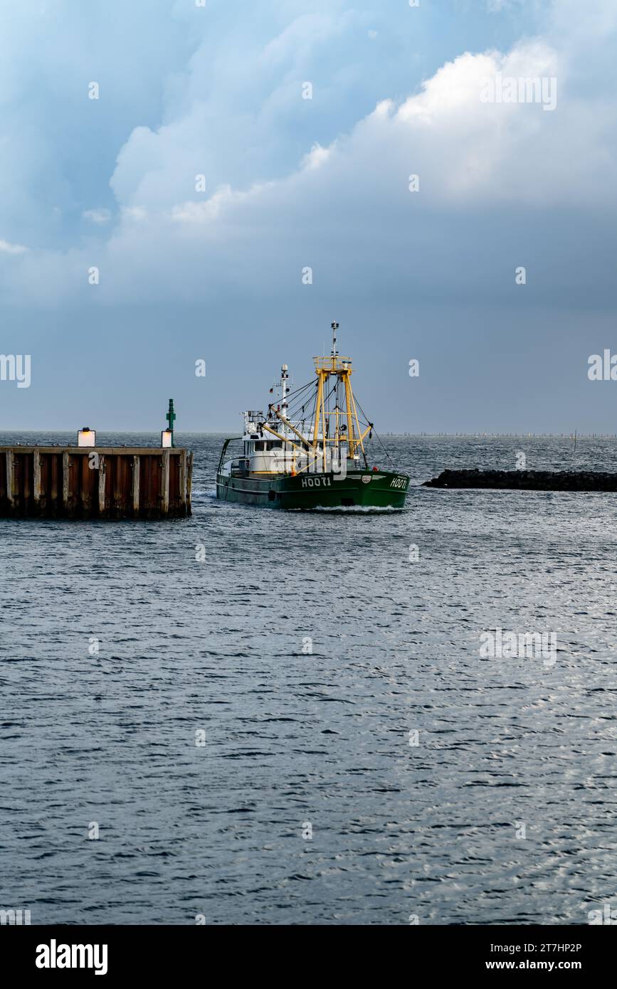 Two motor boats are sailing peacefully on a tranquil, blue body of ...