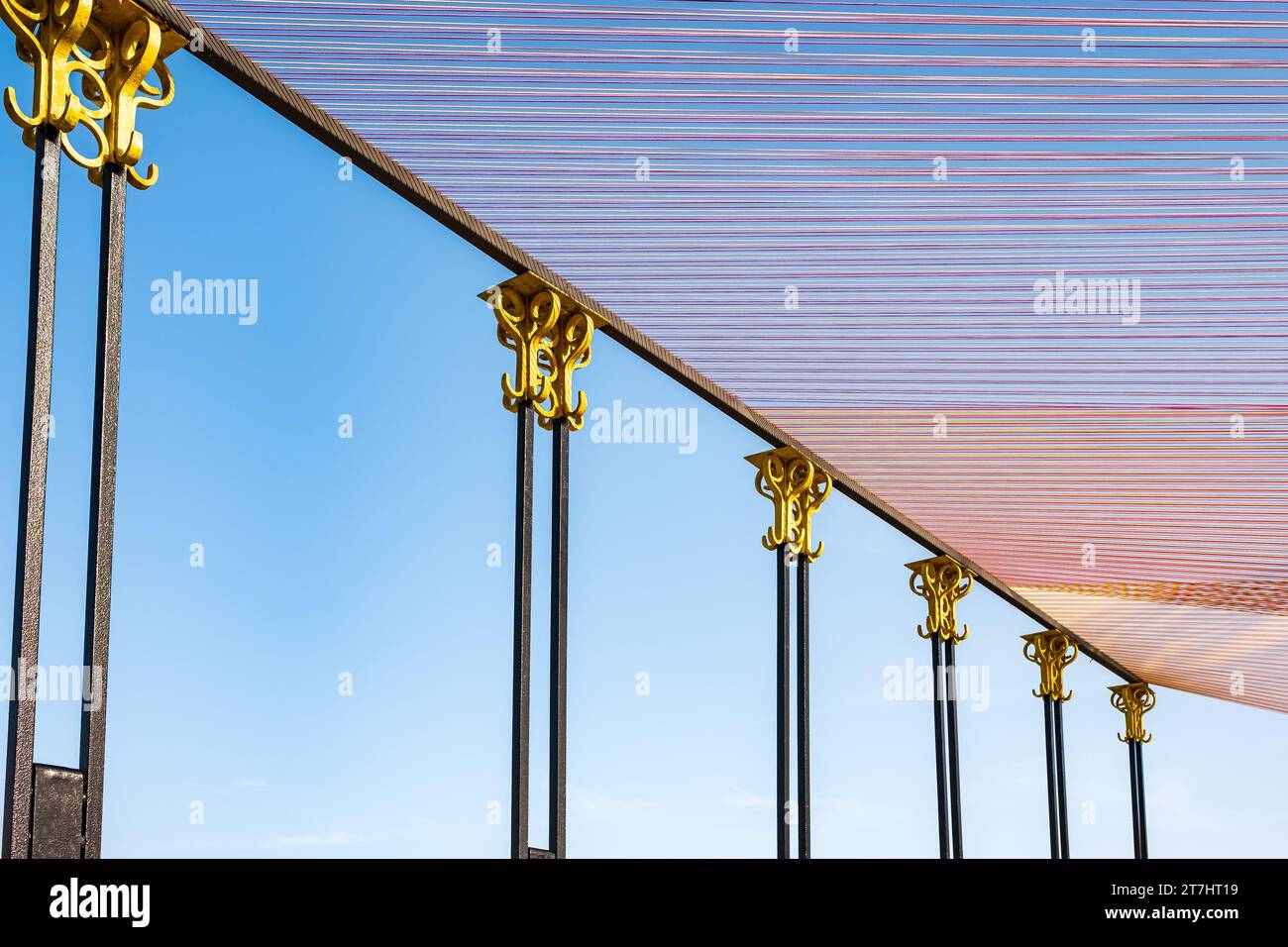 Textile awning in backyard frame gazebo with strings of cover on the ...