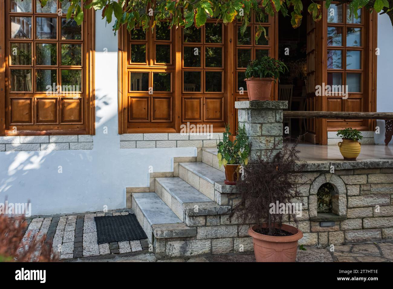 Beautiful and cozy terrace of country house decorated with lots of ...