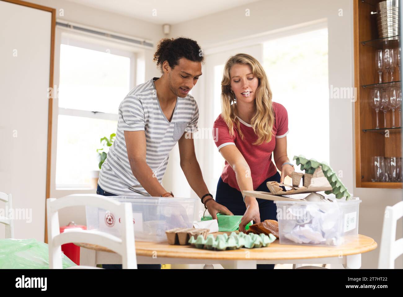 Couple sorting garbage home hi-res stock photography and images - Alamy