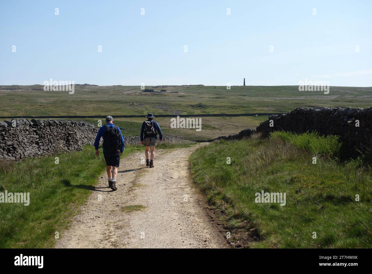 Two Men (Hikers) Walking on a Track to the Smelt Mill Chimney (Flue) at ...