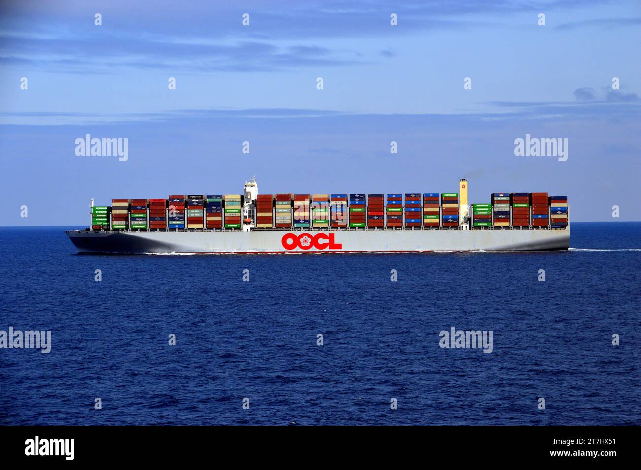 The Container Ship OOCL 'United Kingdom' Sailing in Calm Blue Waters in ...