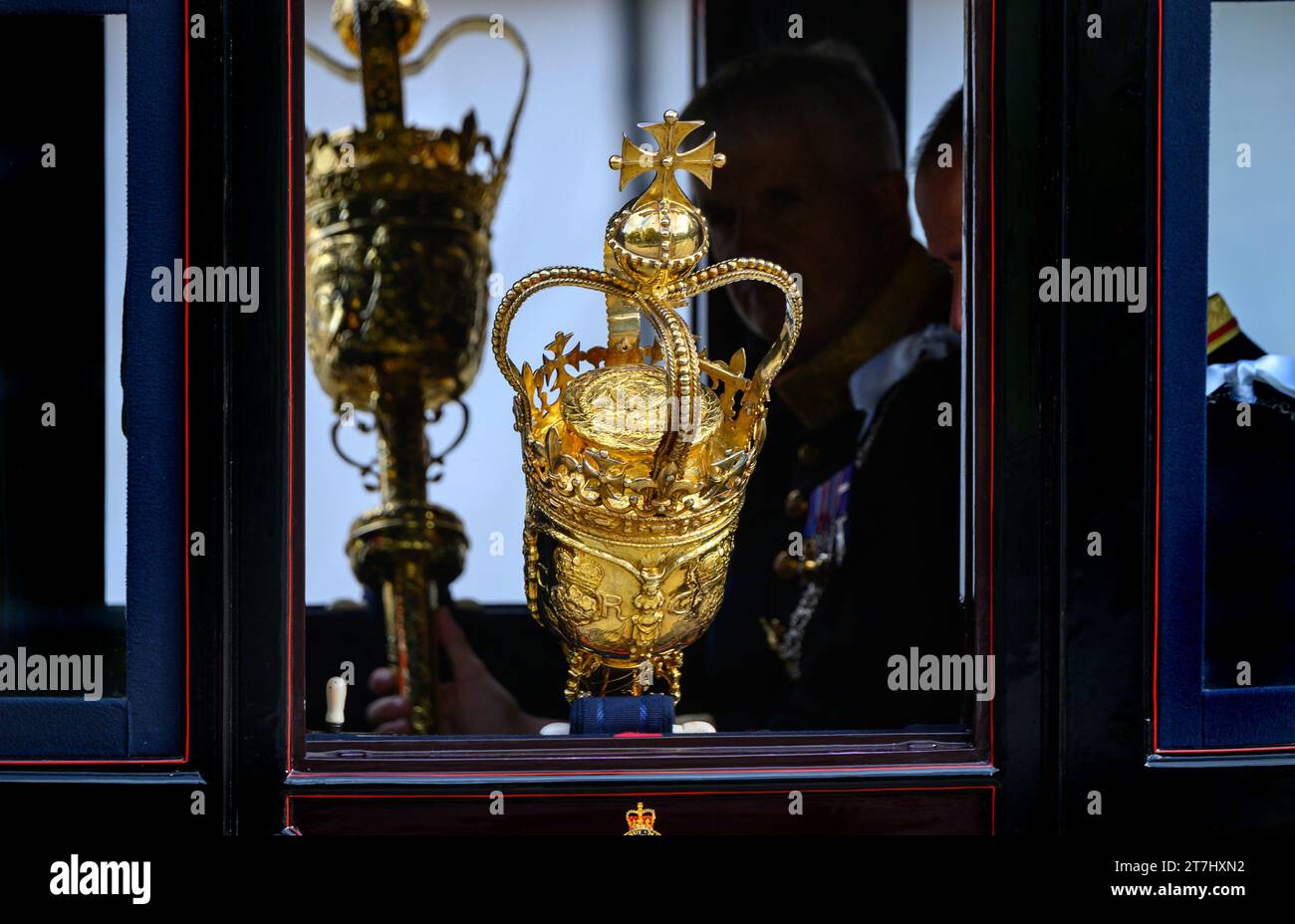 The two ceremonial maces - representing the monarch's authority - being ...