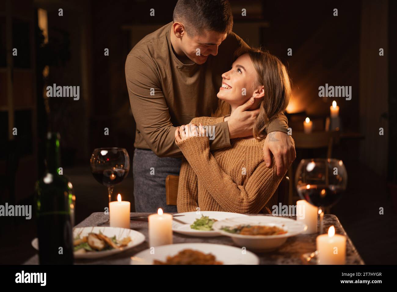 Beautiful passionate couple having a romantic candlelight dinner ...