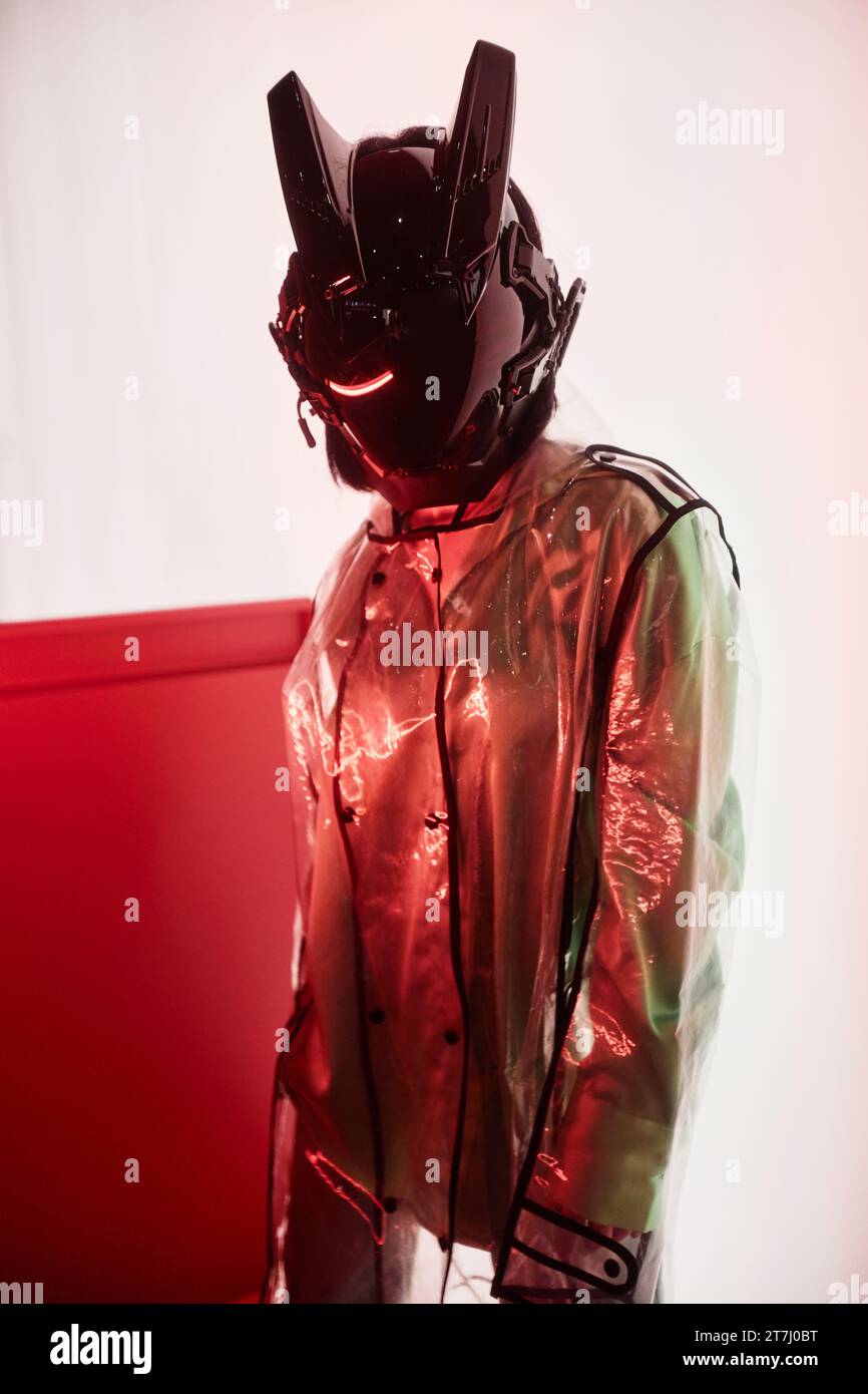 Futuristic art fashion portrait of anonymous young woman wearing helmet ...