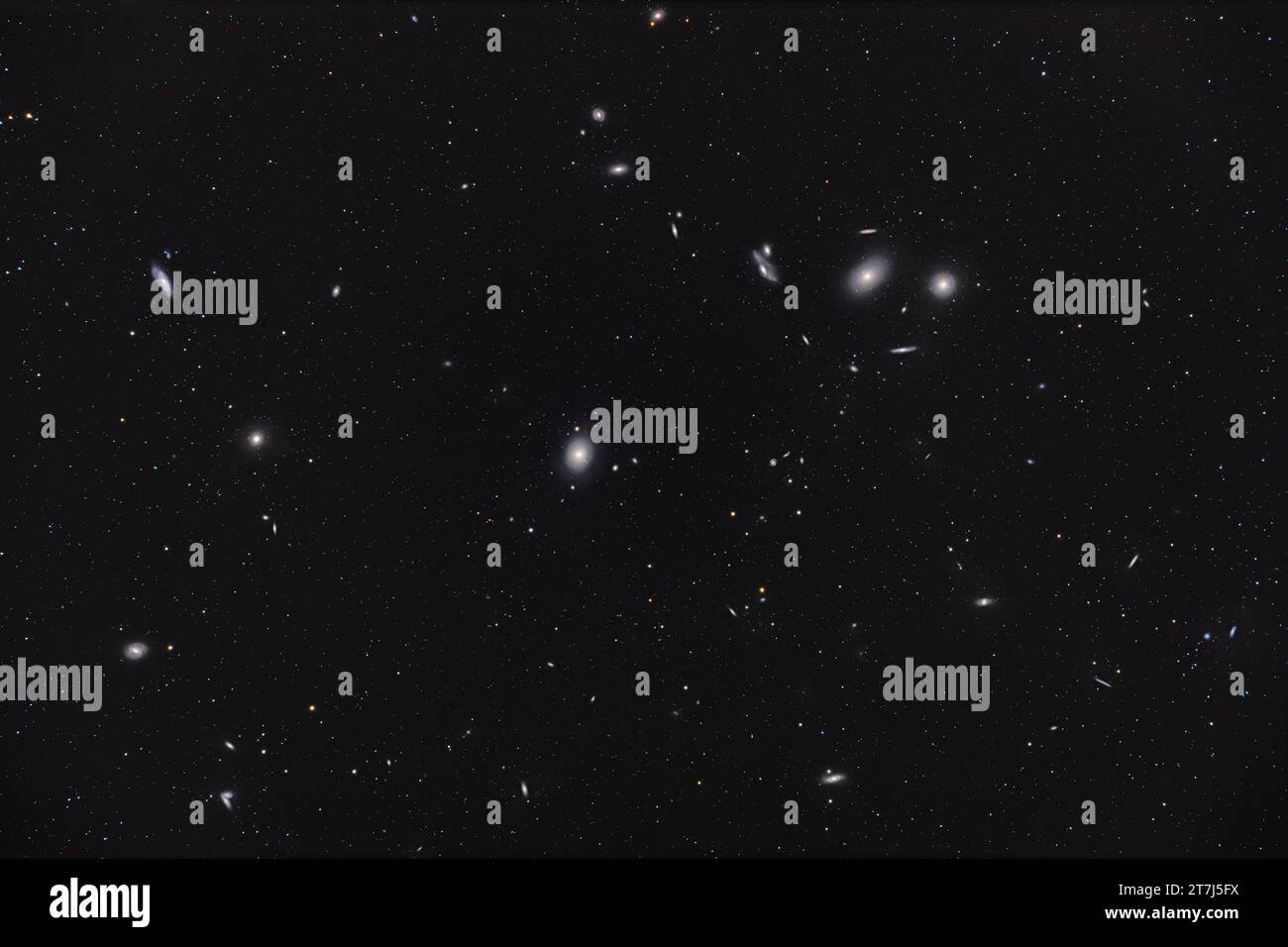 A framing of the core of the great Coma-Virgo Galaxy Cluster, with the bright pair of elliptical ...