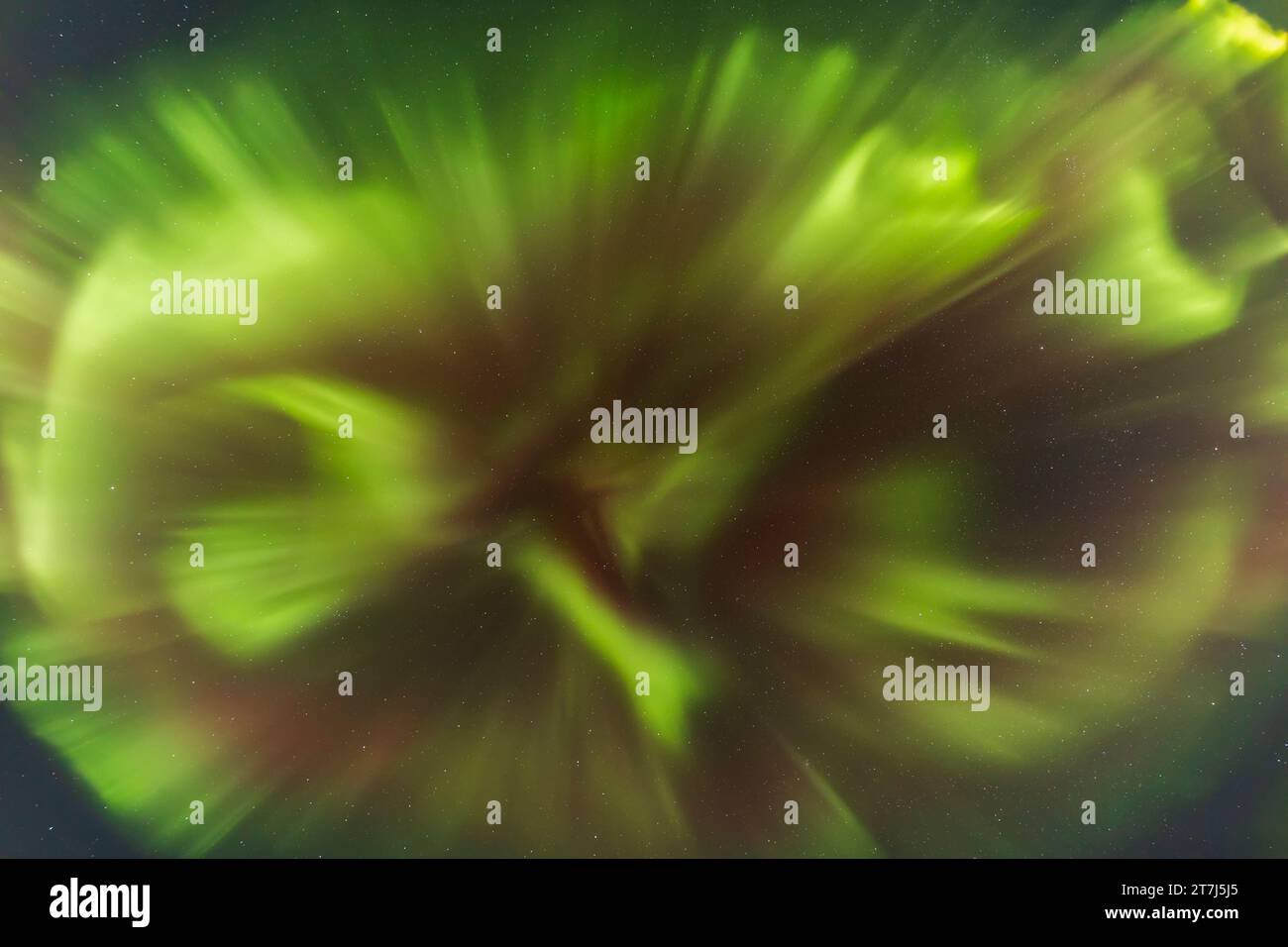 A fish-eye lens image of auroral curtains and rays converging toward ...