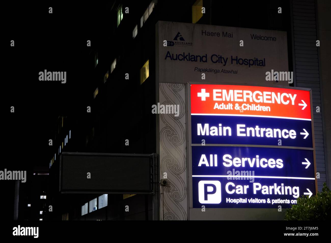 The Auckland City Hospital directional sign at night with arrows ...