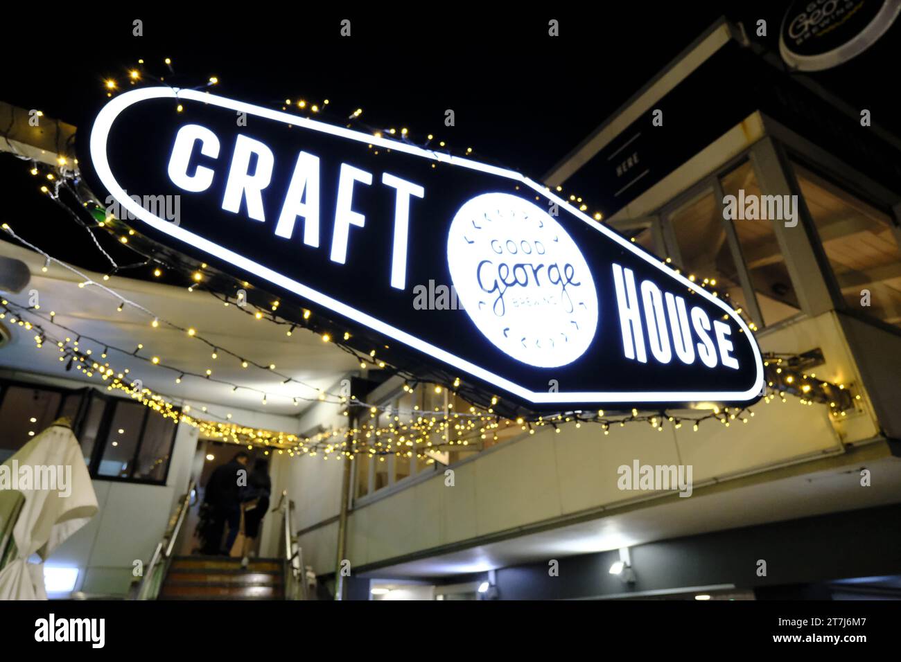 The illuminated sign of Good George Craft House in Auckland Stock Photo ...