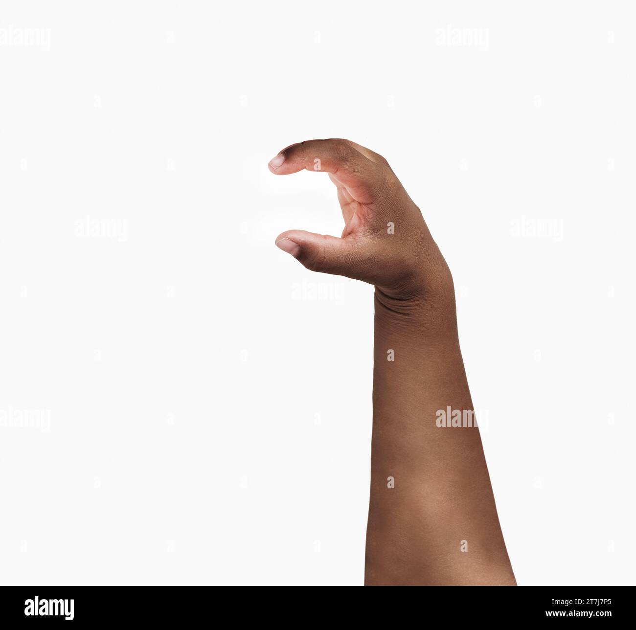 African child hand making the symbol that means pick up on white ...