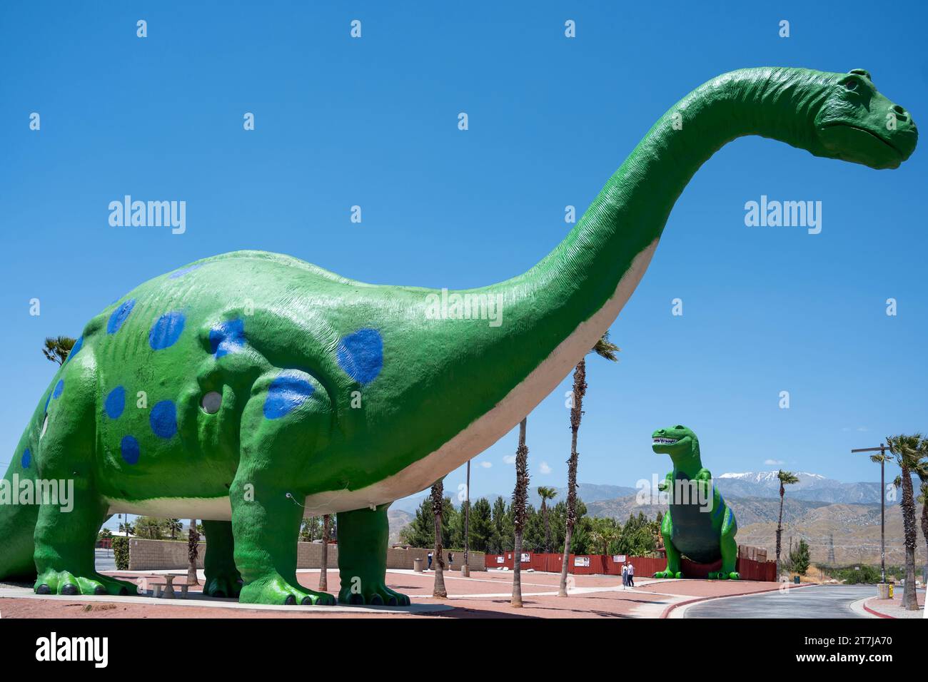 Palm Springs, California - May 12, 2023: Two giant green statues of Dinosaurs in Cabazon ...