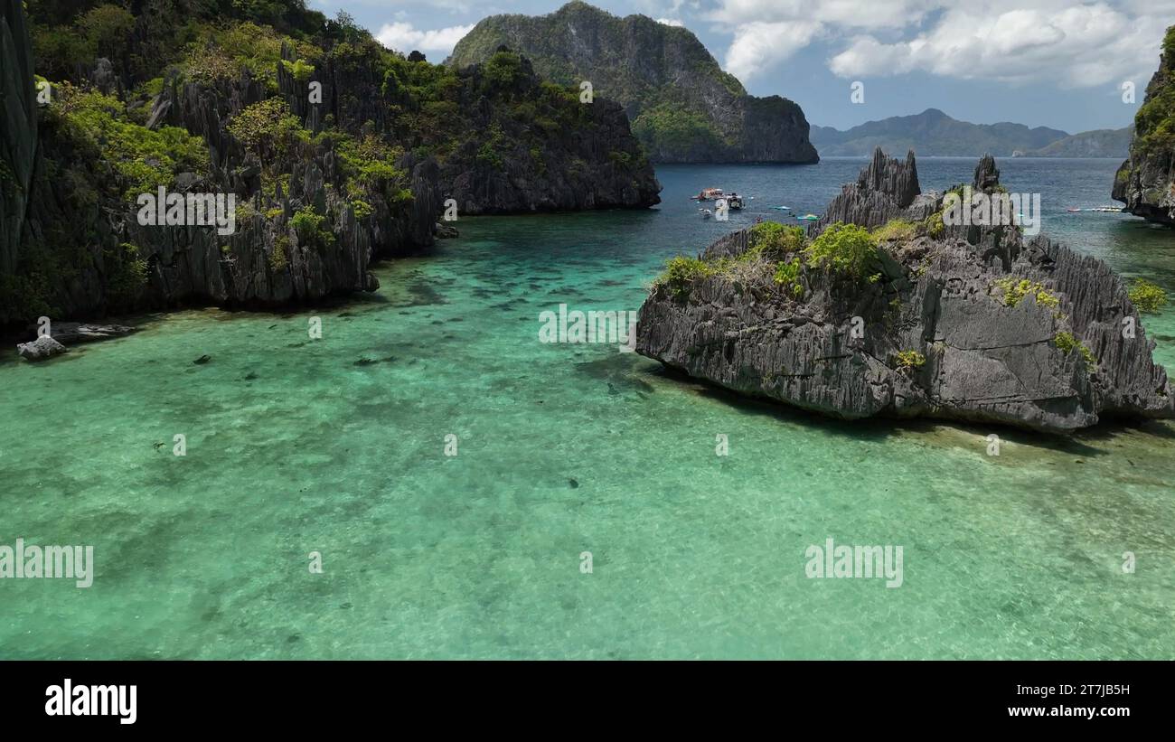 A stunning view of a rock formation in the tranquil Cadlao Lagoon in El ...