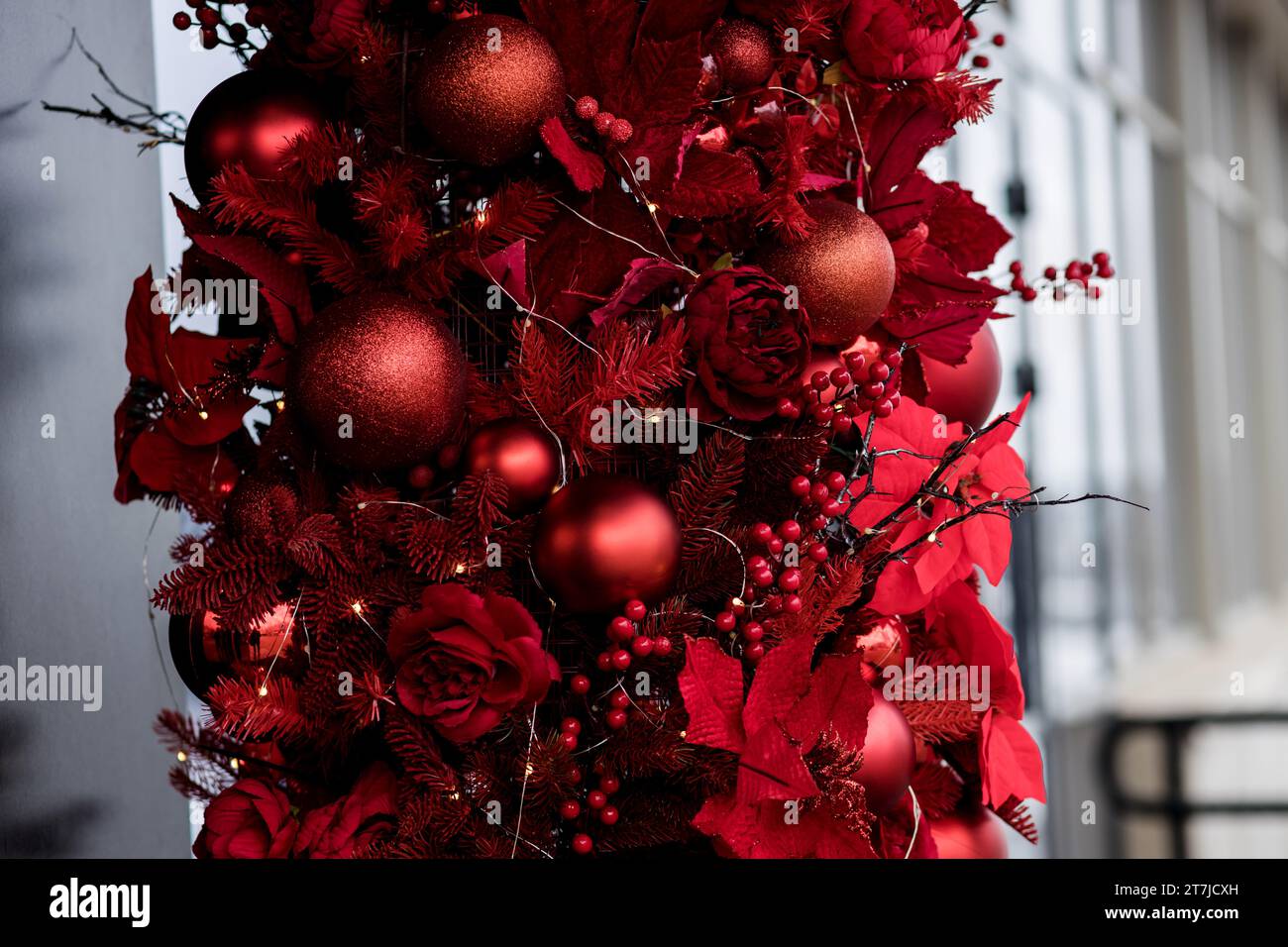 Big red balls on a Christmas tree with snow. festive winter background ...