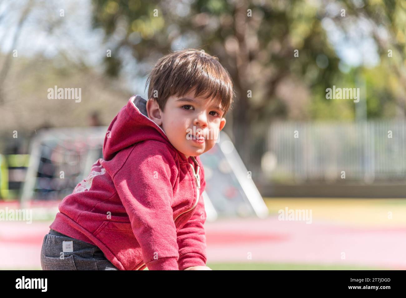 Toddler having fun at the playground Stock Photo - Alamy