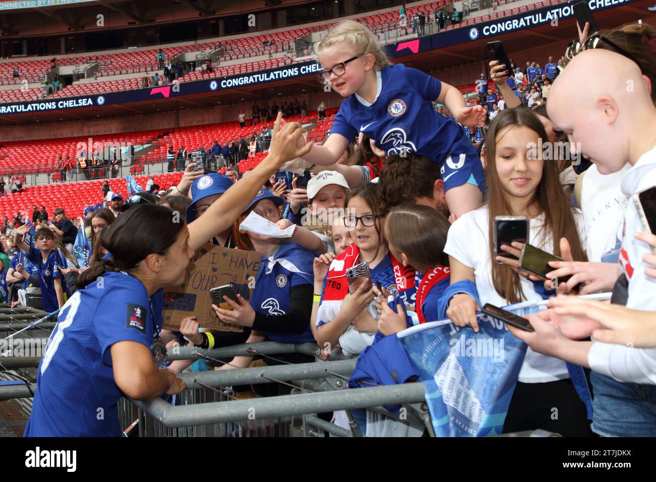 Sam Kerr of Chelsea Women high-fives a young fan at Women's FA Cup ...