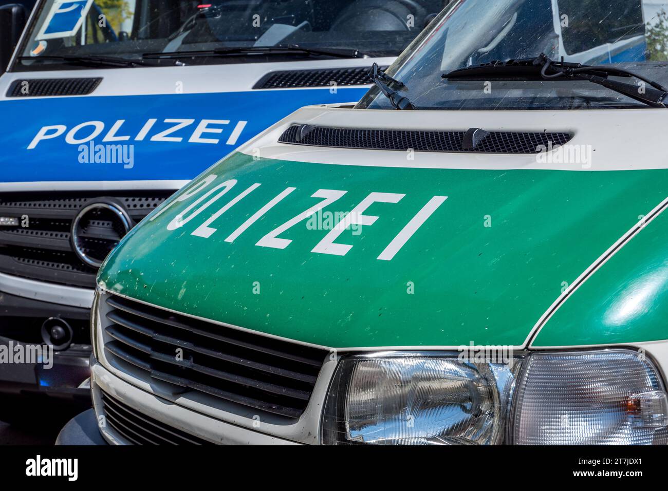 German police cars green and blue Stock Photo - Alamy