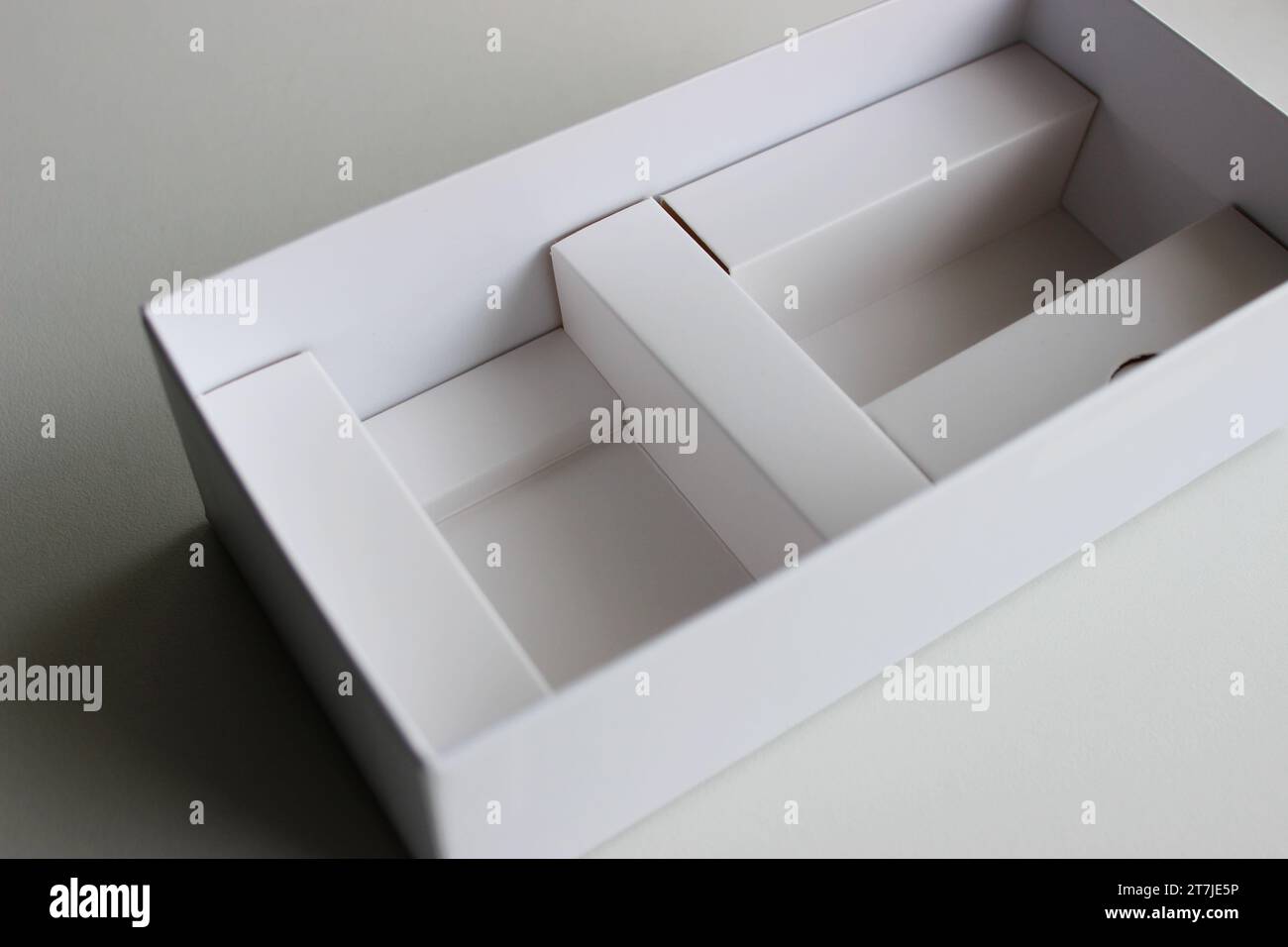 Cardboard box with partitions, reminiscent of a model of a room in a ...