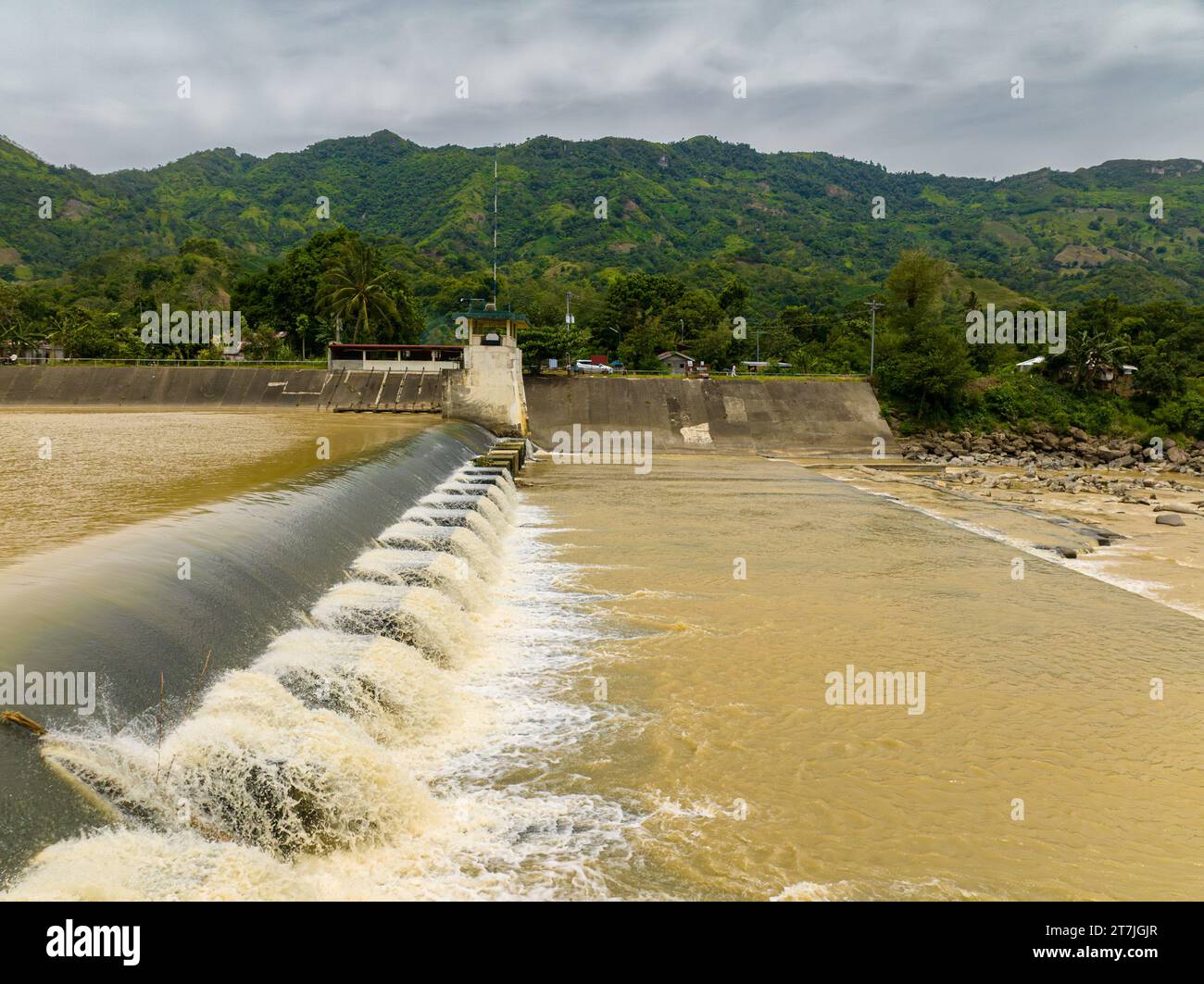 A wall-like structure to block the flow of water through the landscape ...