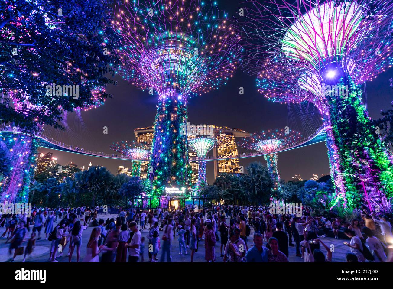 Visitors walk beneath the "Supertrees" during a light and sound show at ...