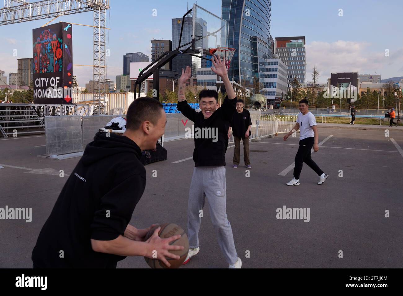 Children play basketball at a city square in Ulaanbaatar, the capital ...