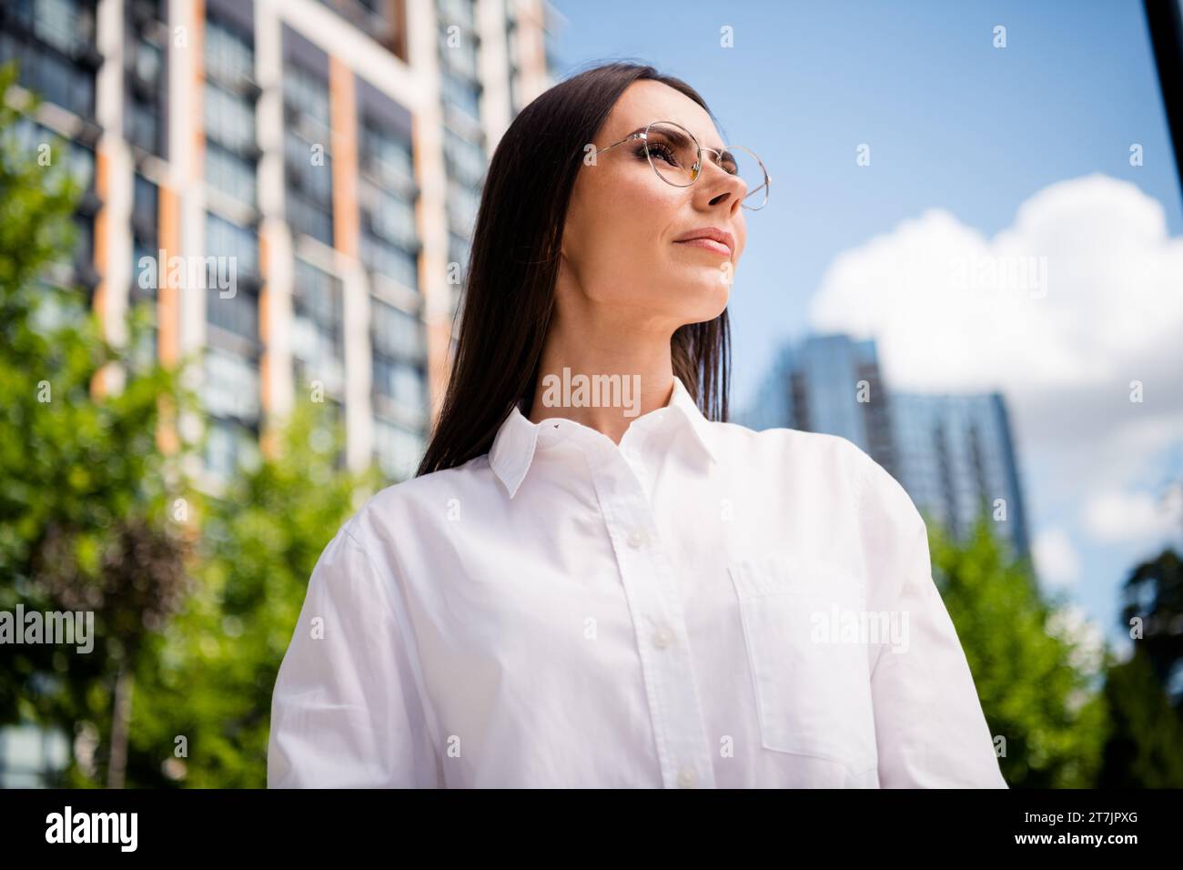Photo of stunning lovely girl enjoying walk sunny city green park modern infrastructure ...