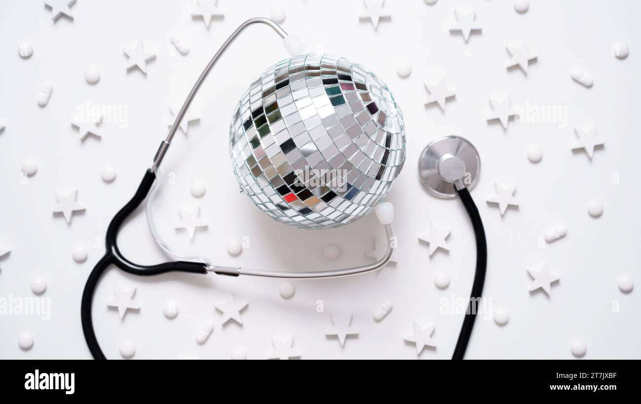 Christmas medical banner.Close-up of stethoscope,disco ball,stars and ...