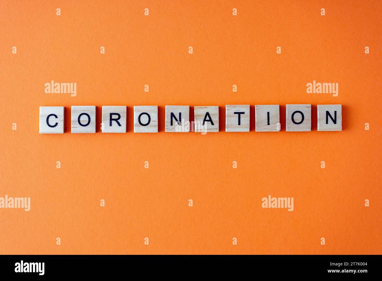 Coronation word. The phrase is laid out in wooden letters top view ...