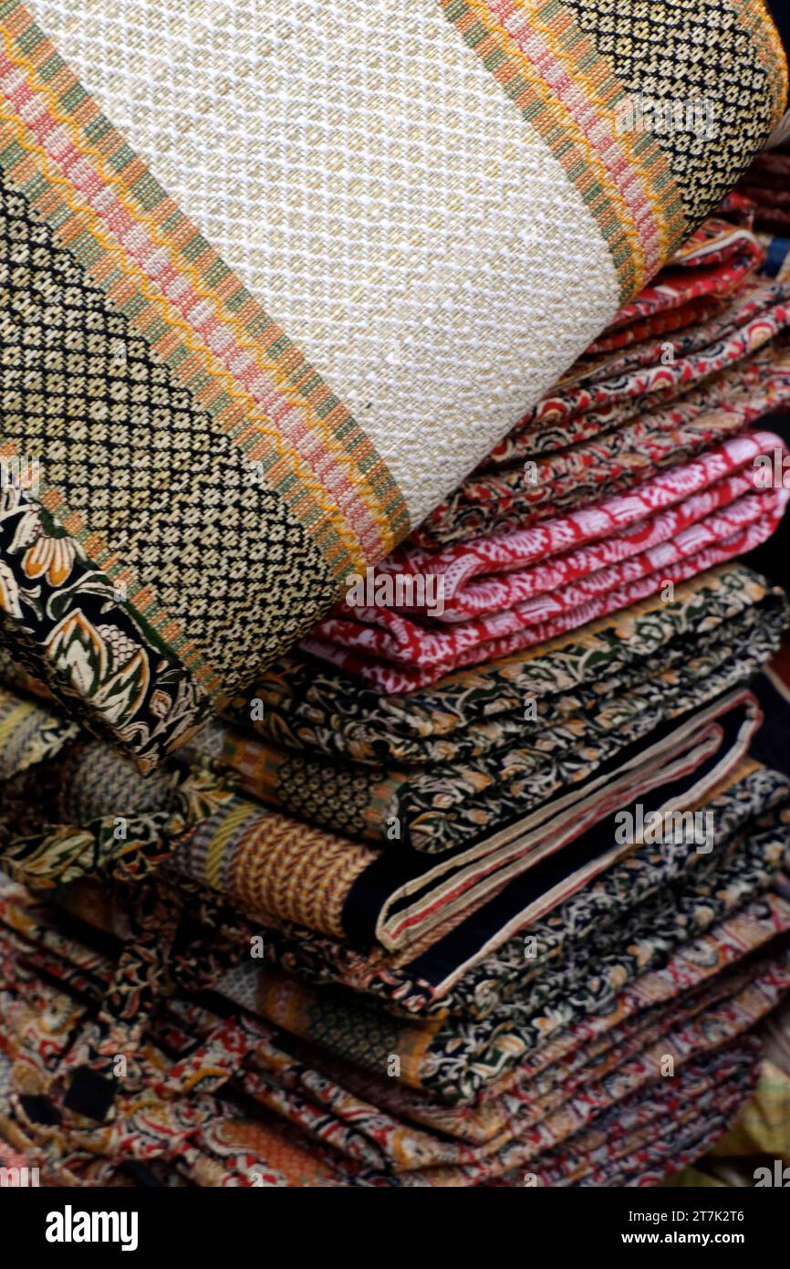 Carpet being rolled and displayed at a carpet exhibition in pune ...