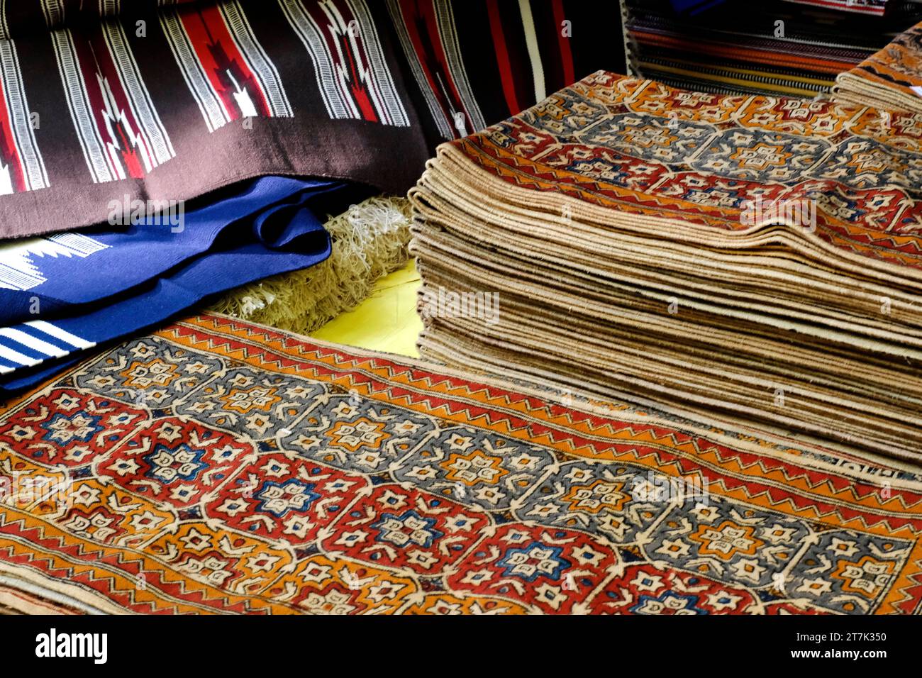 Carpet being rolled and displayed at a carpet exhibition in pune ...