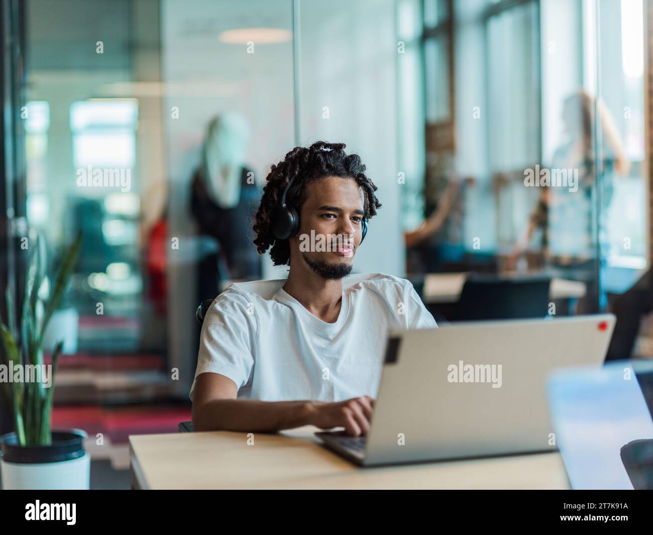 An African-American male, utilizing adaptive technology in his ...