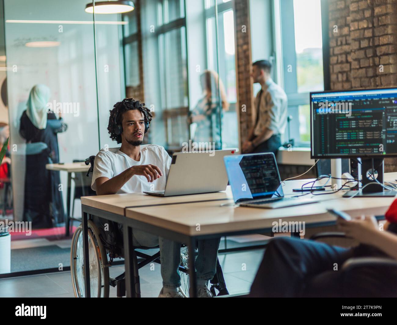An African-American male, utilizing adaptive technology in his ...