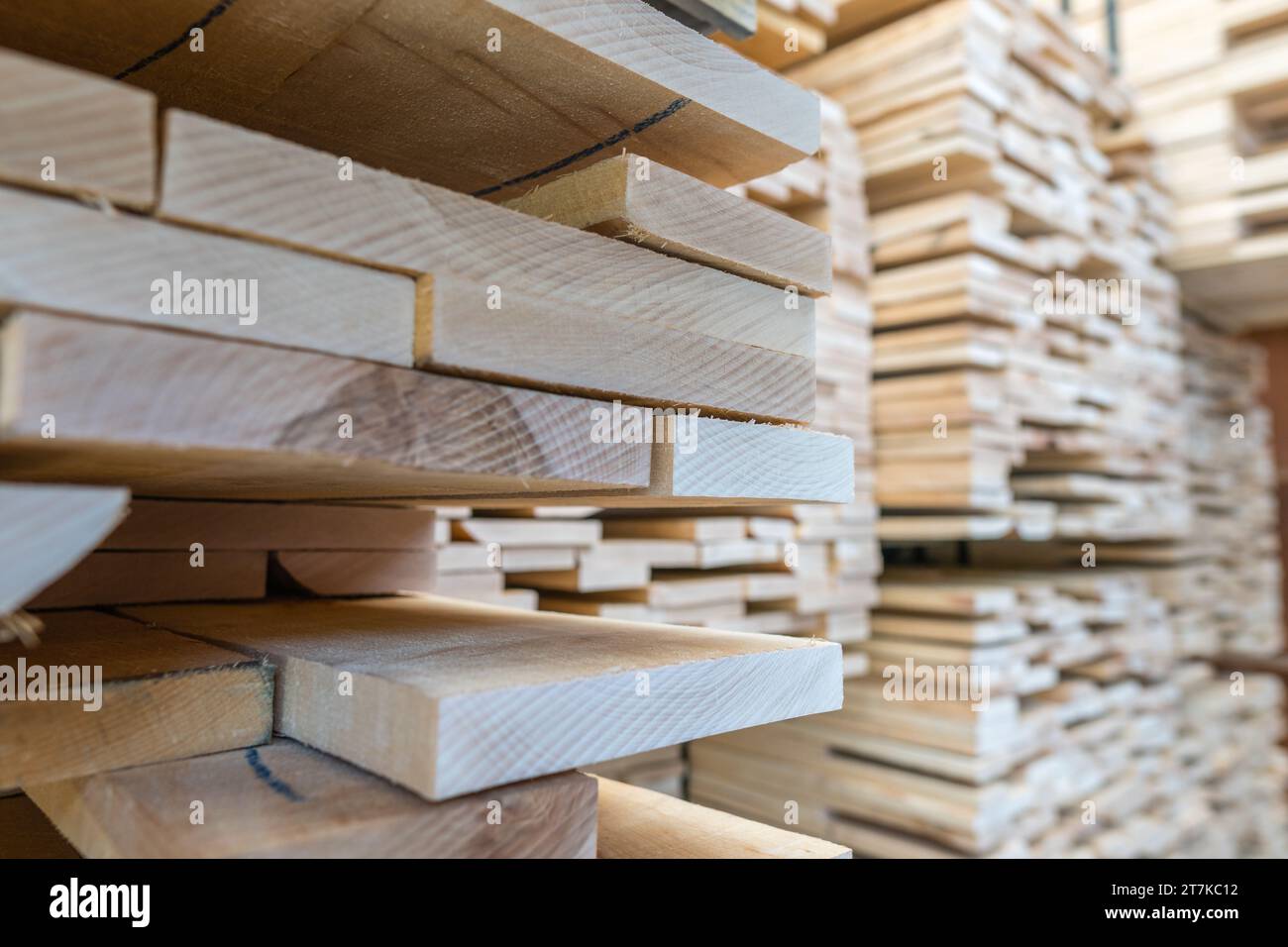 Stacks of lumber being stored in a warehouse Stock Photo - Alamy