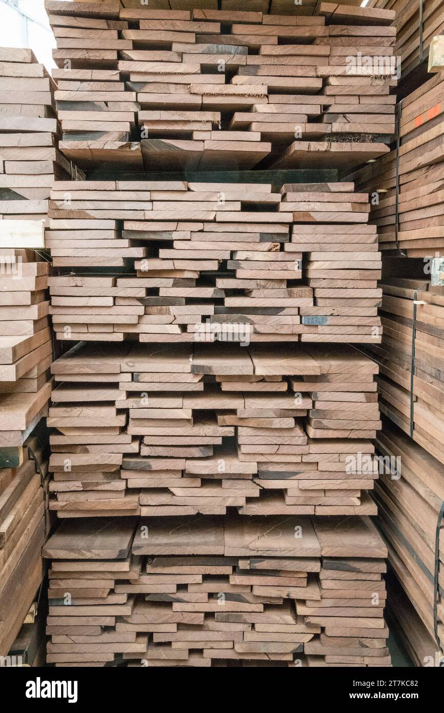 Stacks of lumber being stored in a warehouse Stock Photo - Alamy