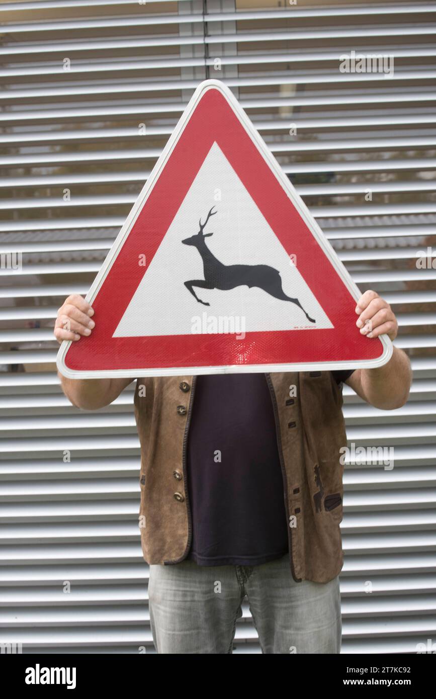 Attention animal crossing traffic or road sign, red triangle as warning ...