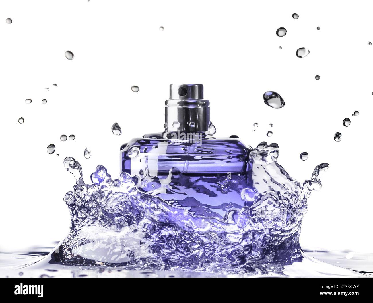 Glass bottle with purple violet toilet water and water splash around it ...