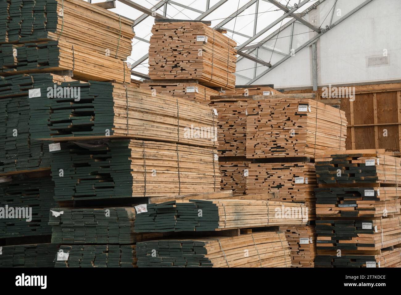 Stacks of lumber being stored in a warehouse Stock Photo - Alamy