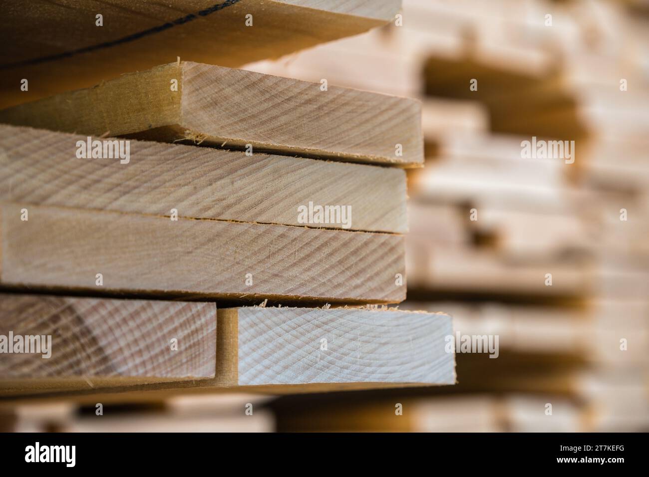 Stacks of lumber being stored in a warehouse Stock Photo - Alamy