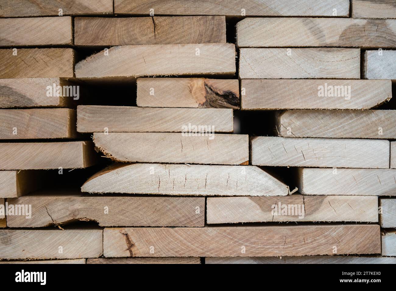 Stacks of lumber being stored in a warehouse Stock Photo - Alamy