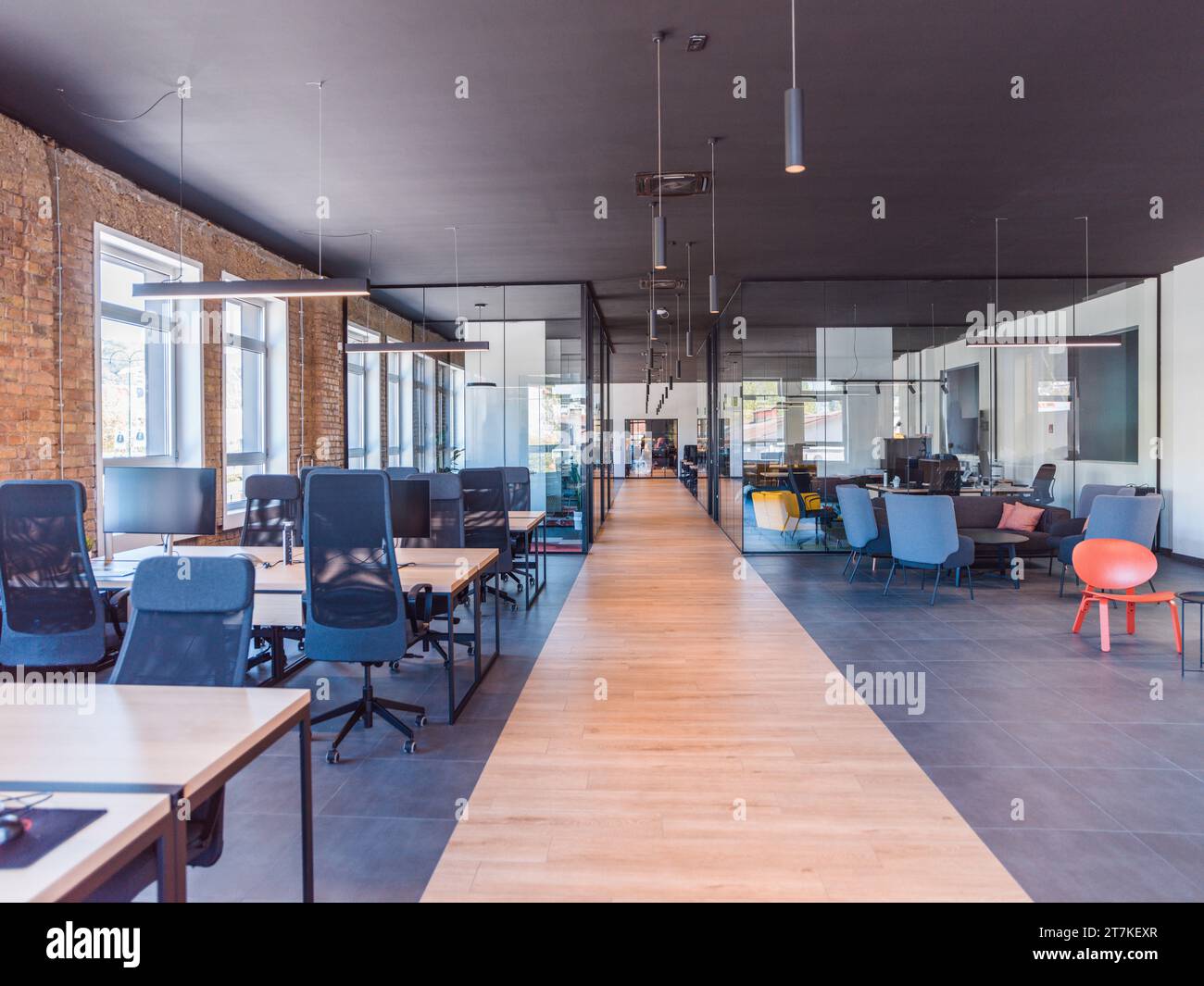 In a setting of modern, glass-walled business startup offices, the open ...