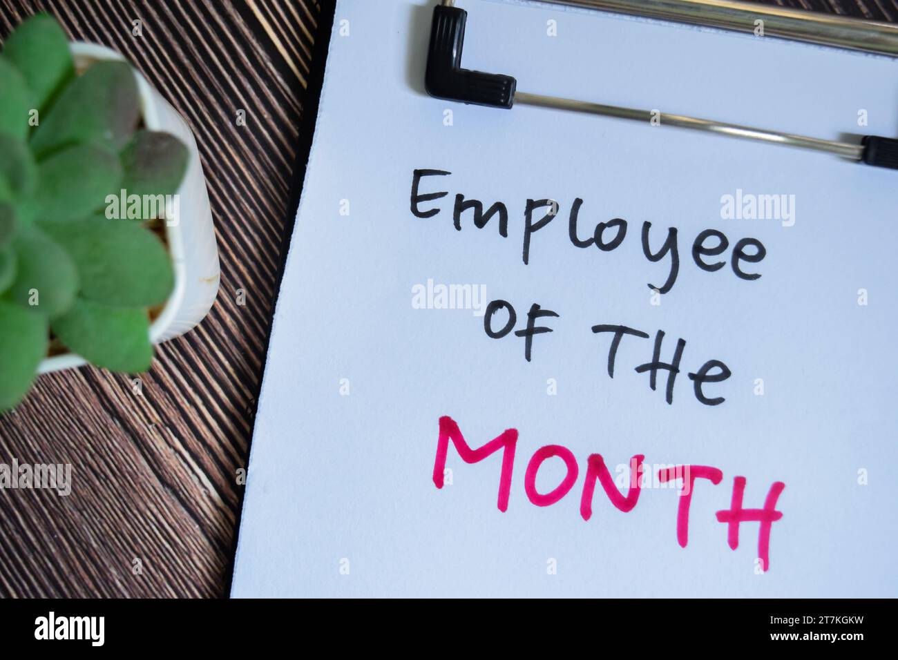Concept of Employee Of The Month write on paperwork isolated on Wooden ...