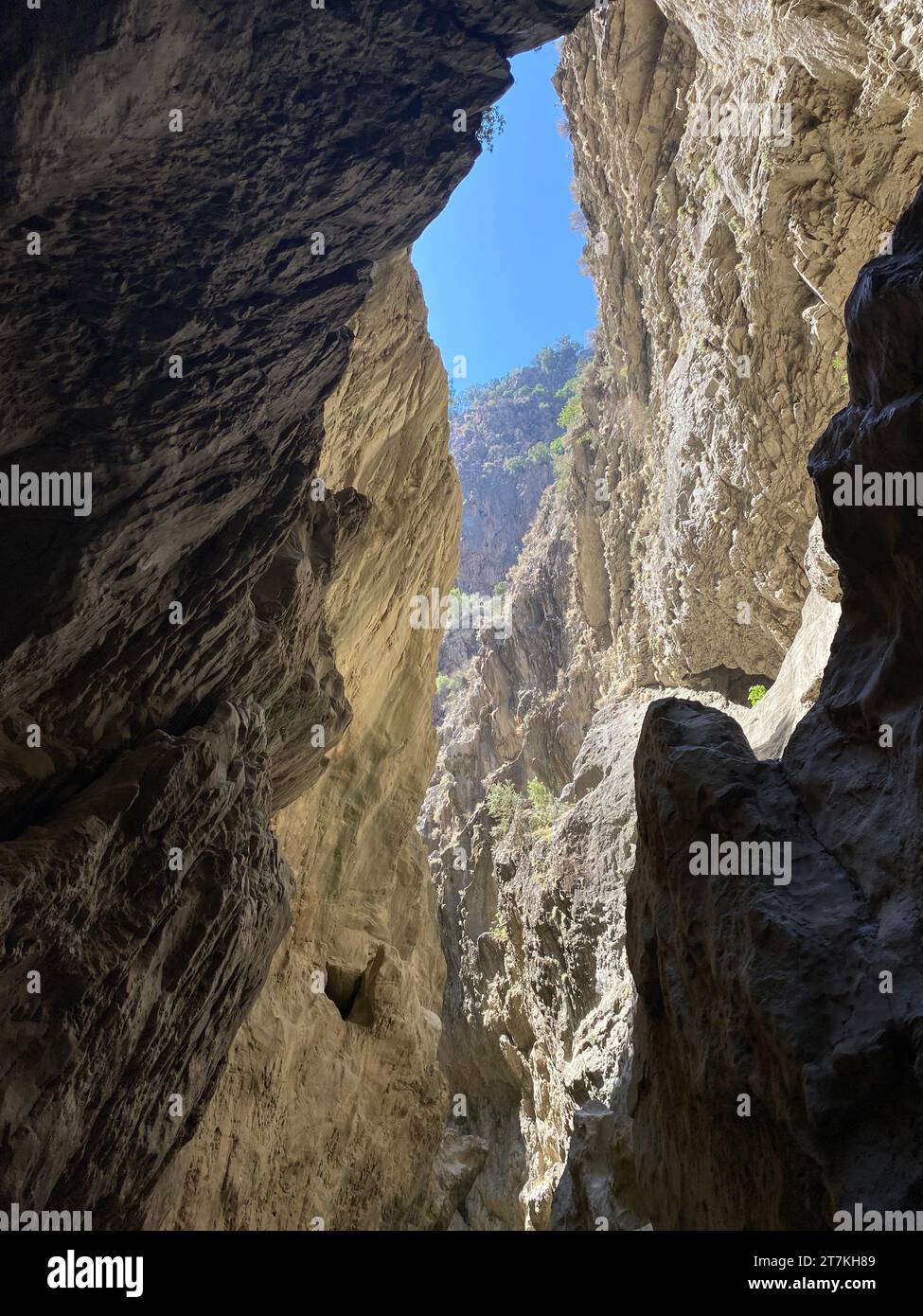 The blue sky seen through a crack between cliffs Stock Photo - Alamy