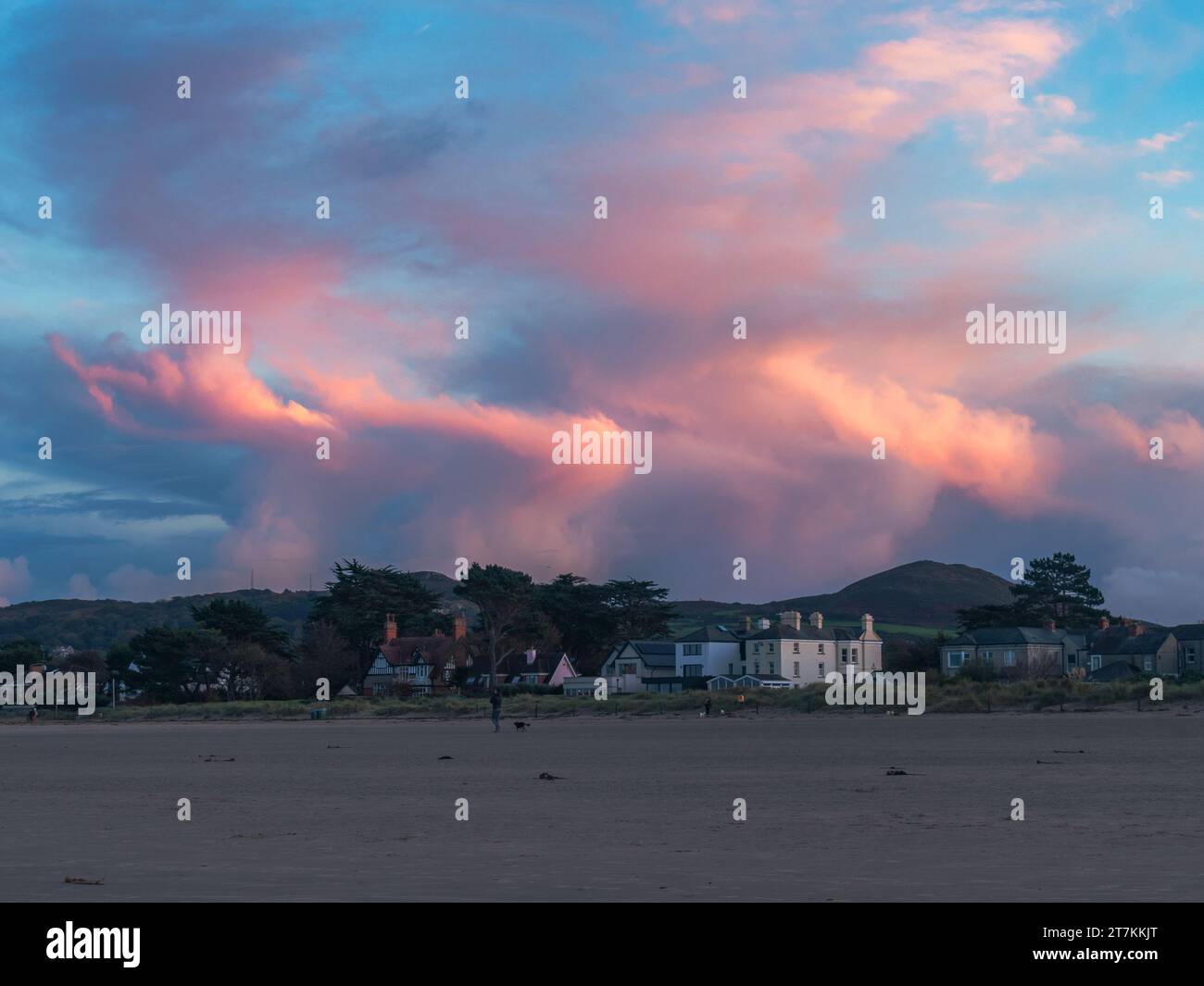 Clouds glowing pink after sunset on Burrow Beach looking towards Howth ...