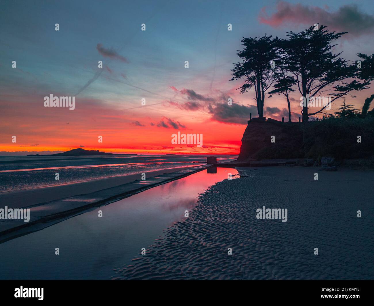 Red dawn sky over Burrow Beach before Storm Babet reaches Ireland's ...