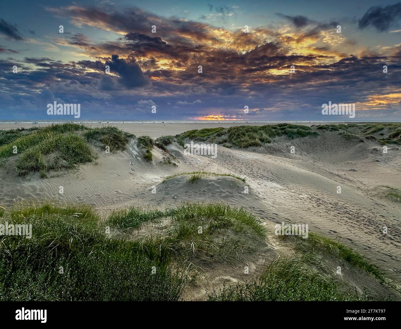 Sunset on the beach of the north sea island Romo in Denmark Stock Photo ...