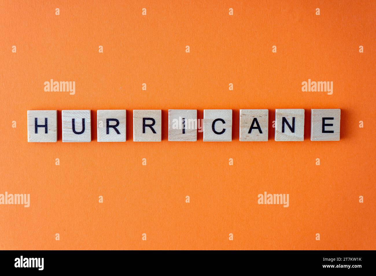Hurricane word. The phrase is laid out in wooden letters top view ...