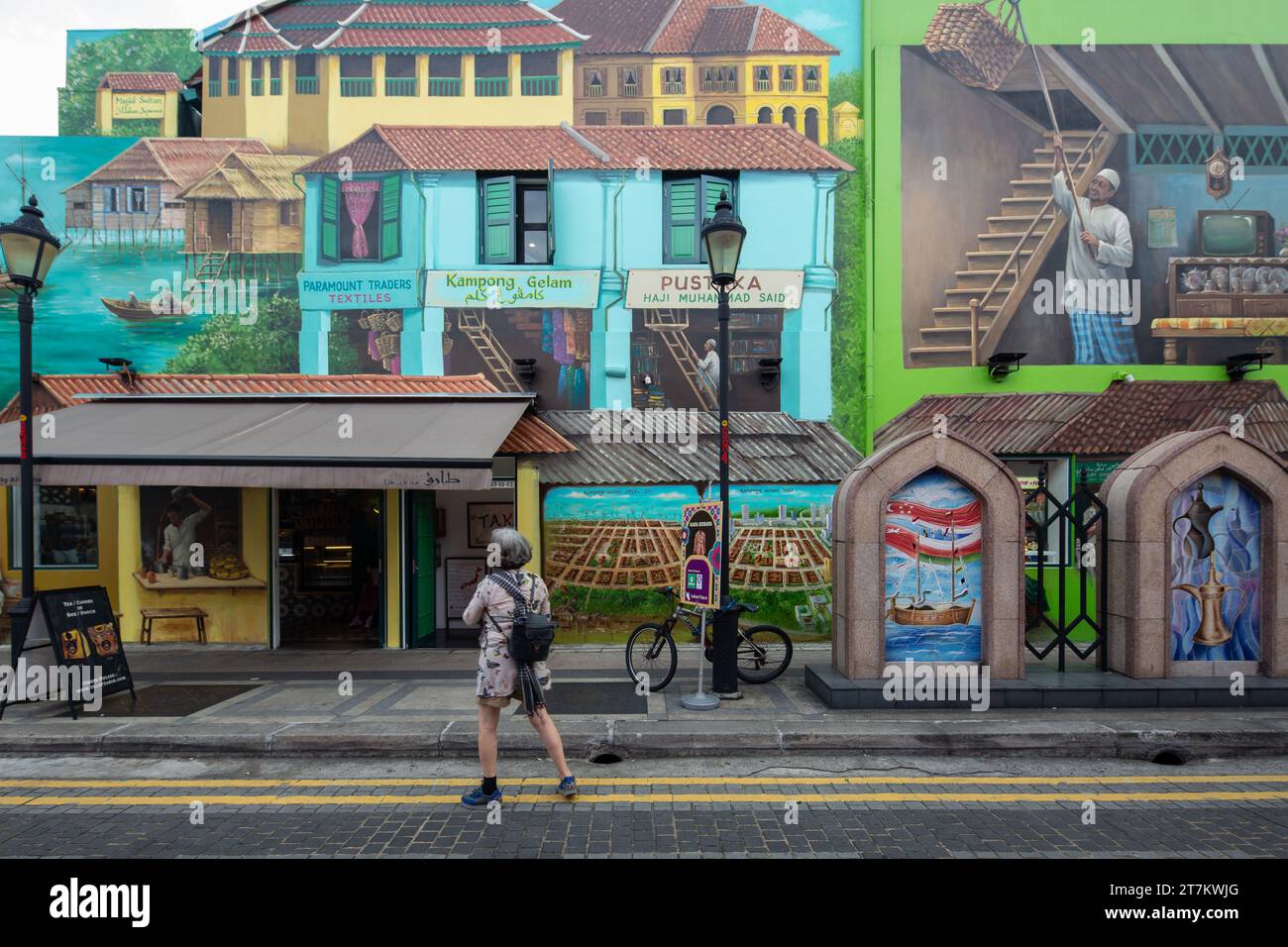Visitor is checking out colourful wall mural that depicts the history ...