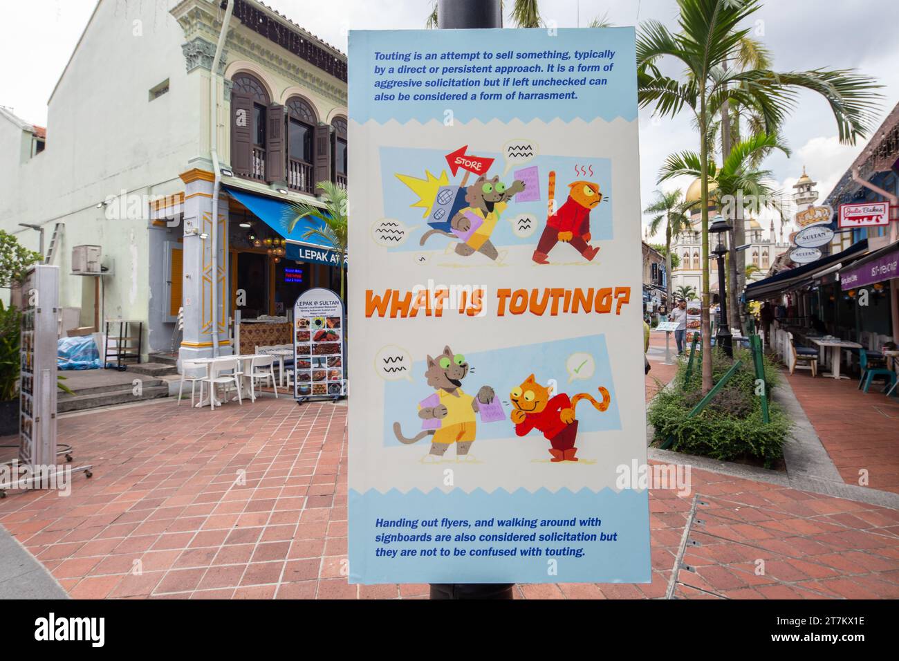 Colourful graphics illustration poster signboard on lamp post shown to ...