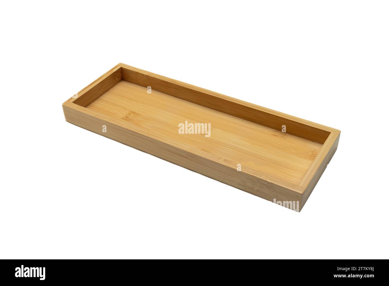 A close-up shot of a rectangular bamboo serving tray placed at an angle ...